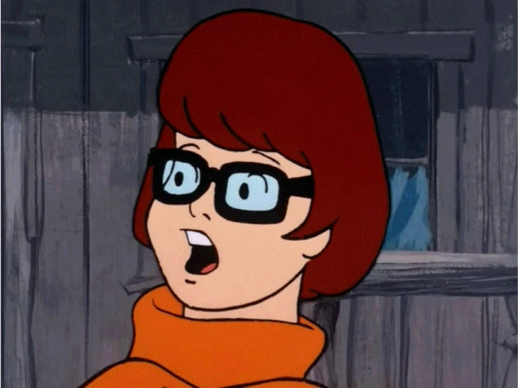 Velma hides her head into her shirt | Fandom
