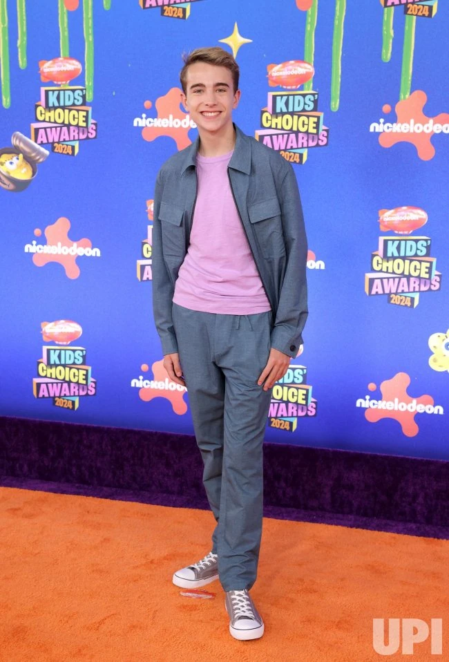 Wolfgang Schaeffer Wears a Charming Air Force Blue Suit and Lavender T ...