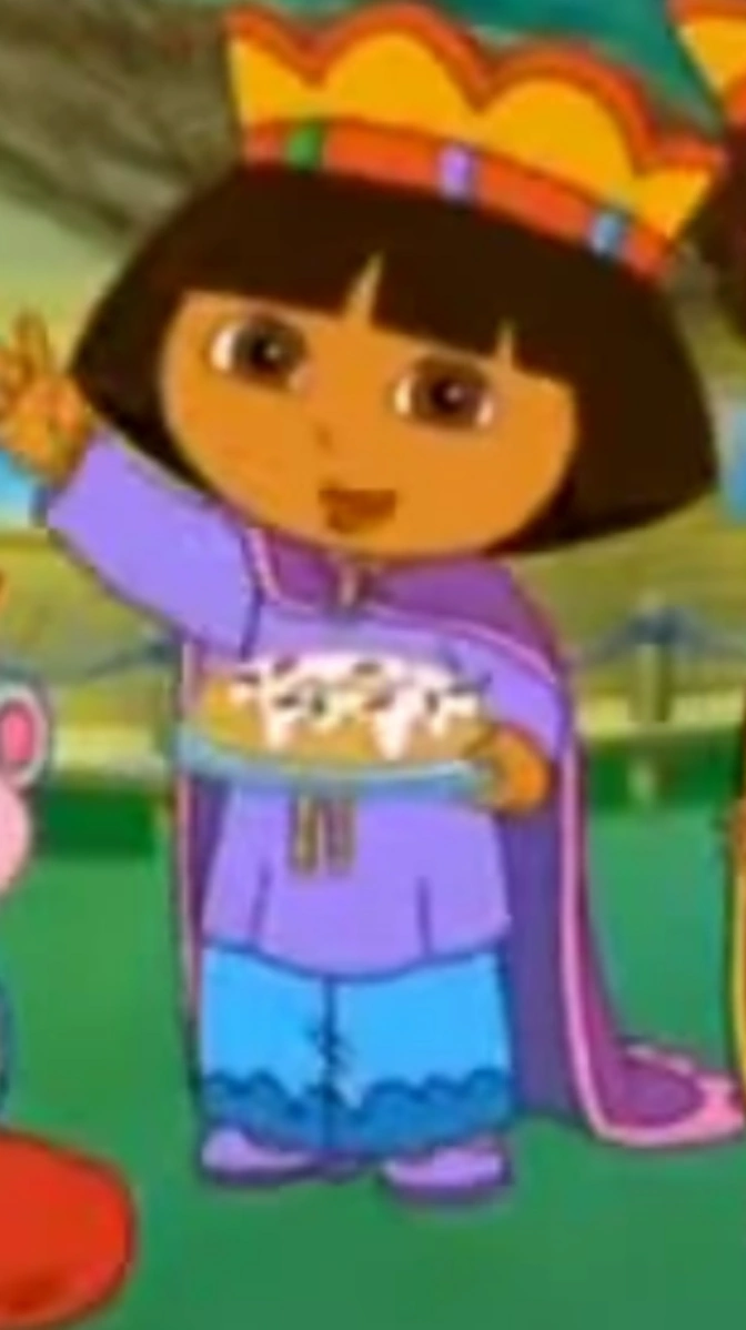 Queen Dora with a cake | Fandom