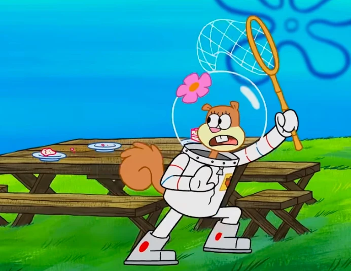 What is Sandy holding? (Wrong answers only) | Fandom