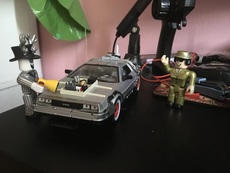 3 photos of Asimo/Badcc figurines with a Delorean | Fandom