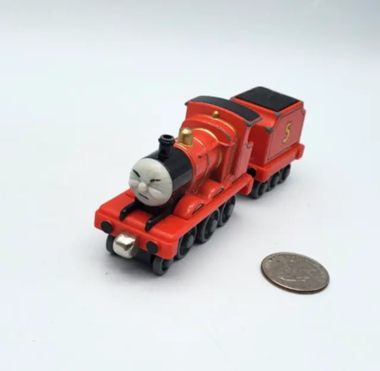 There is a Clenched Face Take Along James with Grey Wheels that exists ...