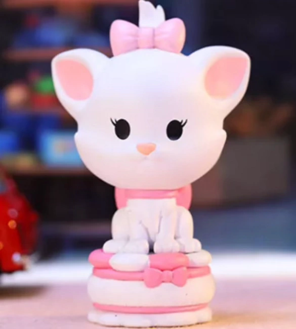 Mini Marie on a pink and white chair stool | Fandom