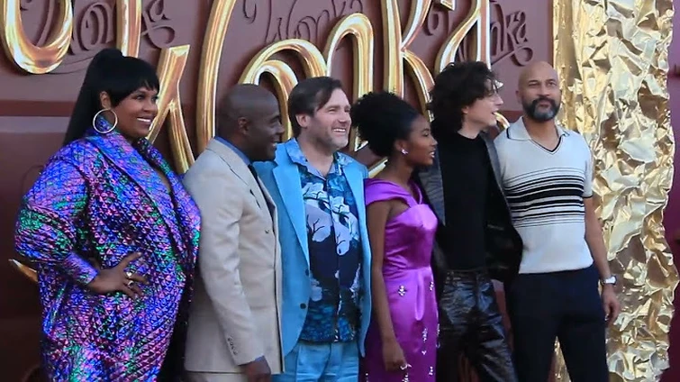 The cast of the WONKA premiere laughs on the red carpet. | Fandom
