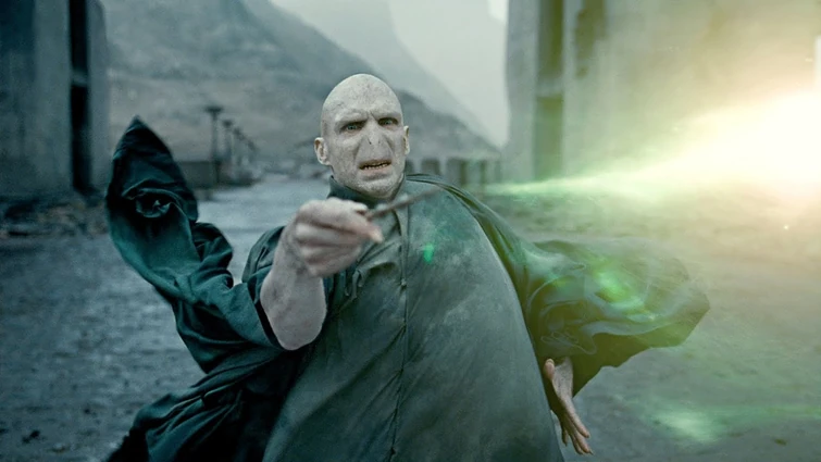 Why does Voldemort wear a green robe in the movies instead of a black ...