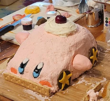 This really cool Kirby cake one of my friends on Discord made for her ...