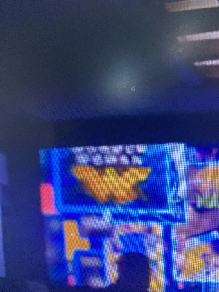 A poster of Wonder Woman can be seen in the Warner 3000 presentation ...