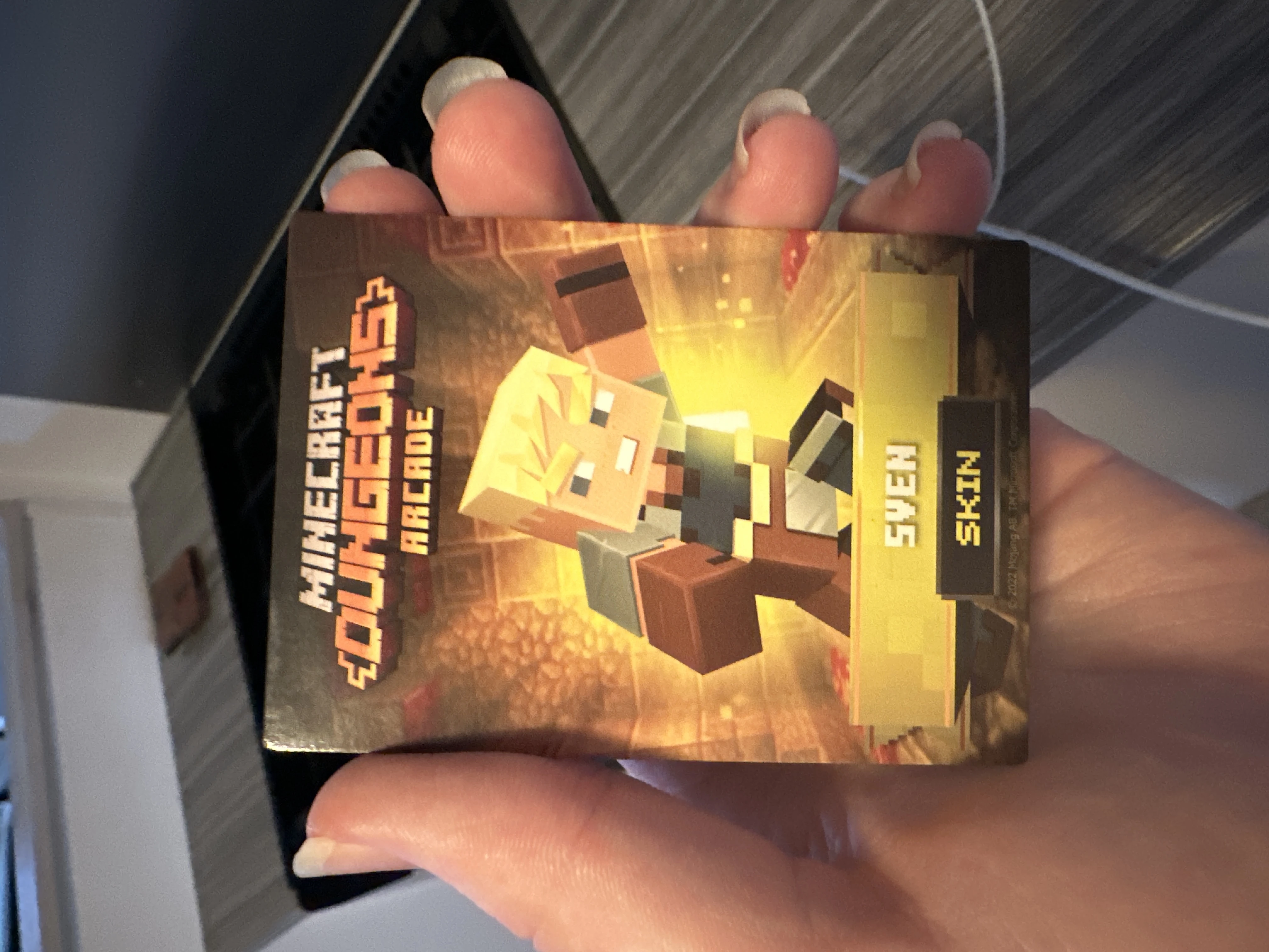 This card that I got playing Minecraft Dungeons at the arcade today ...