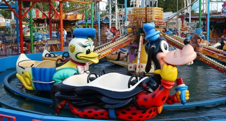 Donald Duck and Goofy kiddie boat rides seen in Lighthouse fairground ...