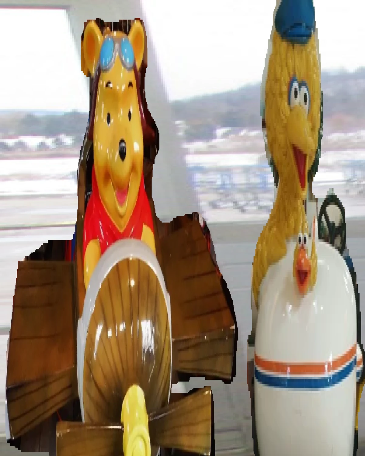 Coin operated kiddie rides - Winnie the Pooh (aeroplane) and Big Bird (jet) rides (only works ...