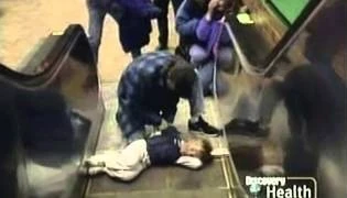 Escalator Traps Boy | Rescue 911 Wiki | Fandom