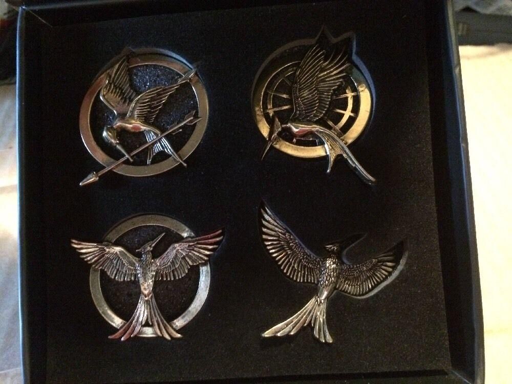 Mockingjay pin The Hunger Games Wiki Fandom