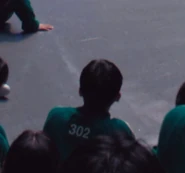 Player 302 | Squid Game Wiki | Fandom