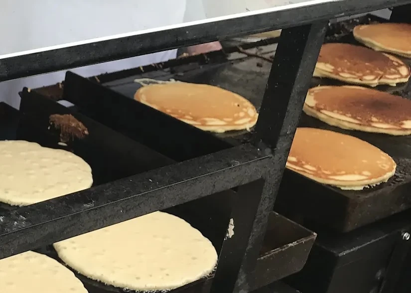 This is Daniel Cook./Gallery/At a winter festival/Making pancakes ...